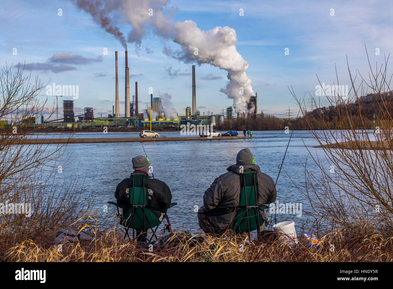 fishing in river Rhine near Duisburg, ThyssenKrupp steelworks in ...