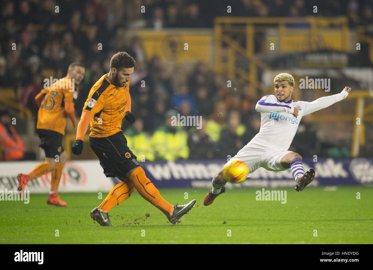 Wolverhampton Wanderers' Matt Doherty (left) is challenged by Newcastle ...