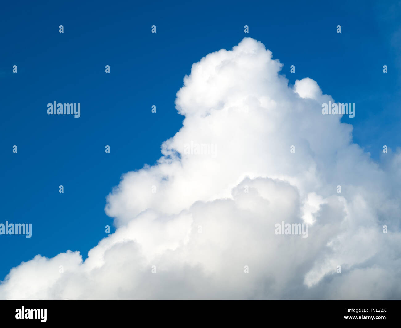 huge clouds on a blue sky background. A weather phenomenon Stock Photo ...