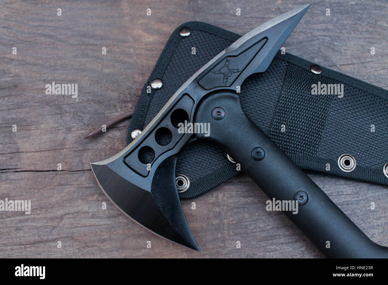 Tactical ax. Ax on wood background. Axe for army Stock Photo - Alamy