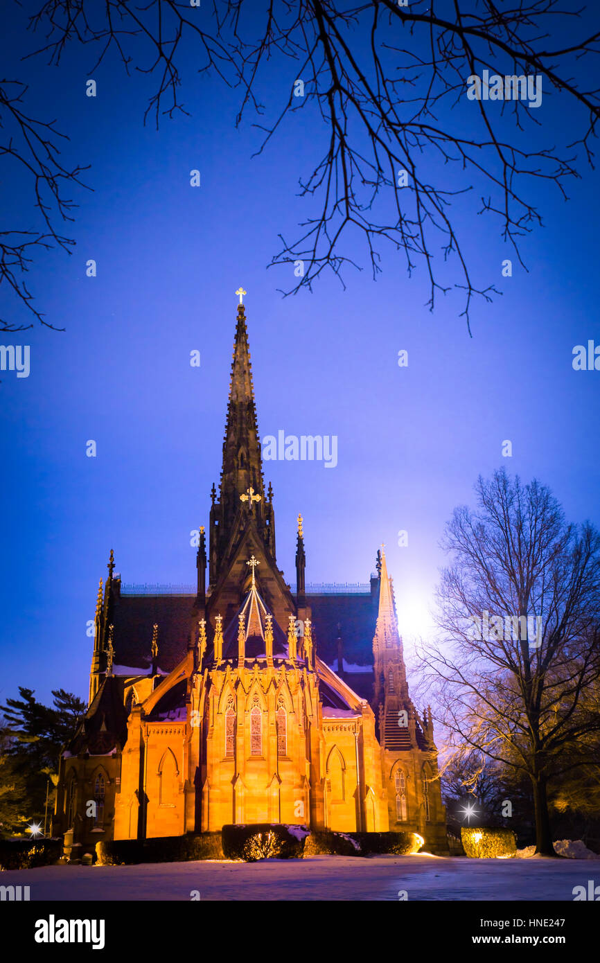 Beautiful cathedral church seen on a snowy winter night with moon ...