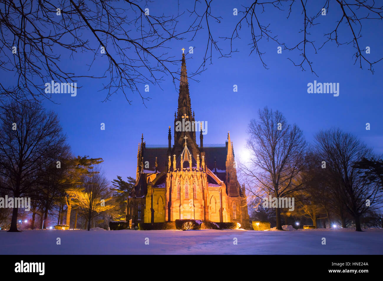 Beautiful cathedral church seen on a snowy winter night with moon ...