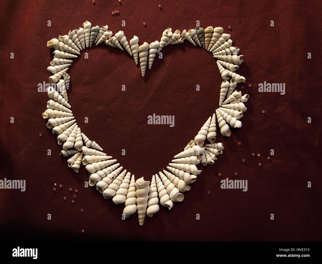 Heart made shells on beach hi-res stock photography and images - Alamy