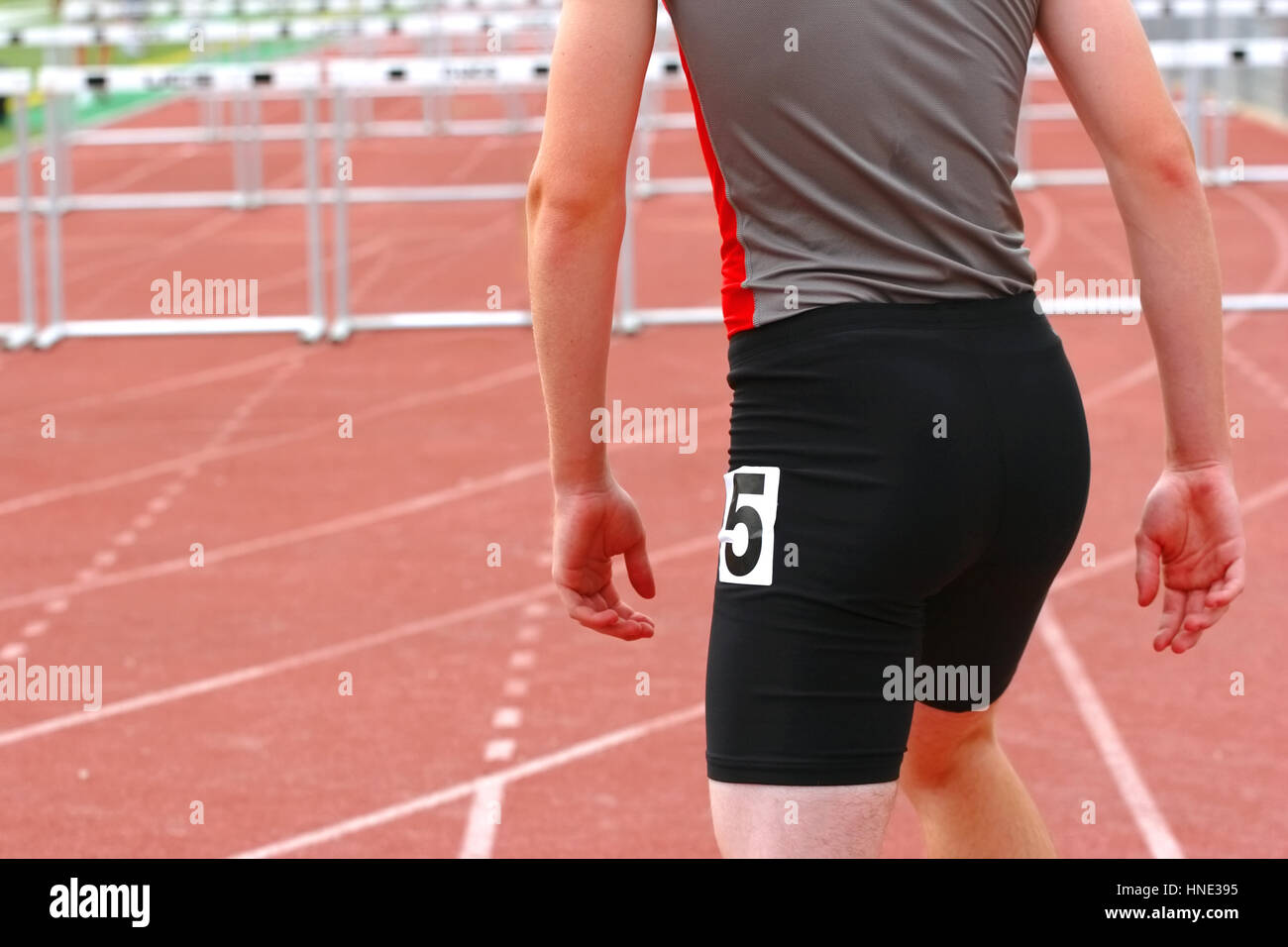 a runner before the start of a hurdle race Stock Photo - Alamy