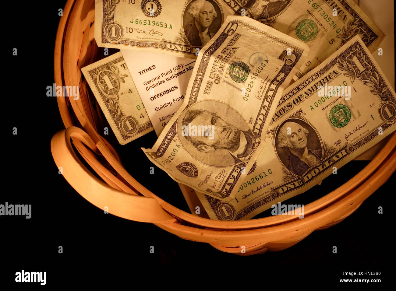 A basket full of money Stock Photo - Alamy