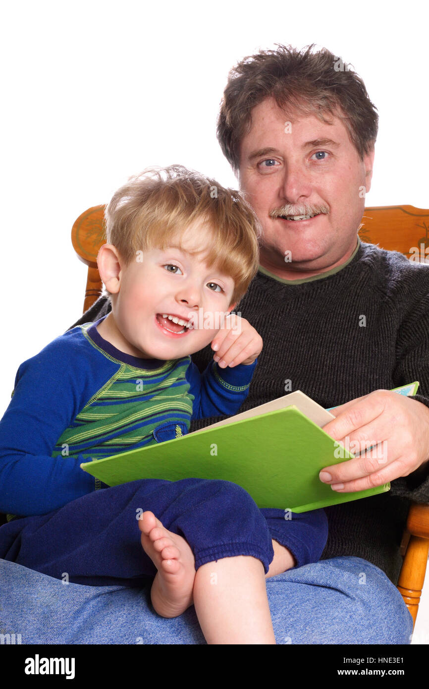 A father is reading to his young son Stock Photo - Alamy