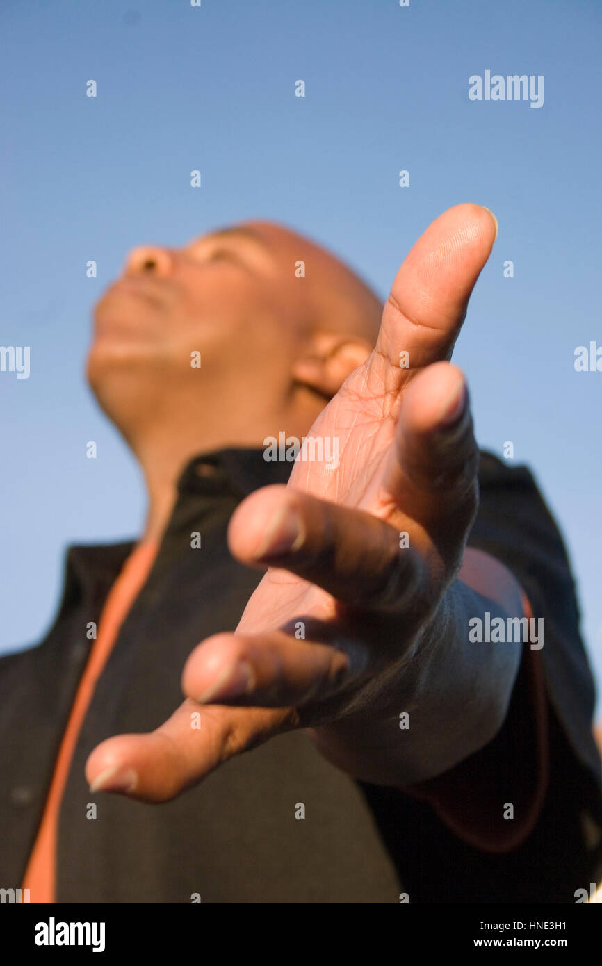 African American man with open arms in deep worship Stock Photo - Alamy