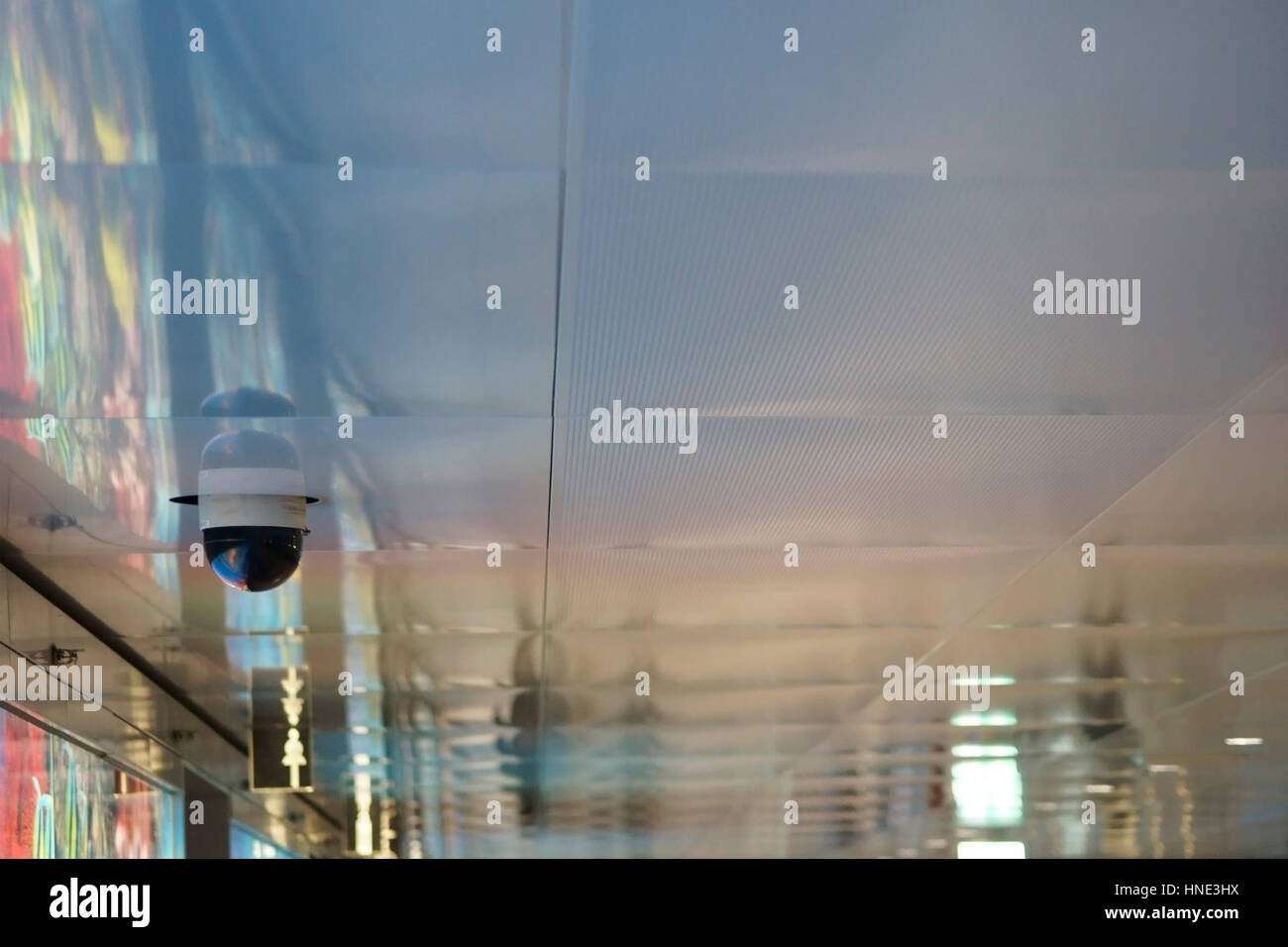 An abstract metal cover panel with an all-round surveillance camera and ...