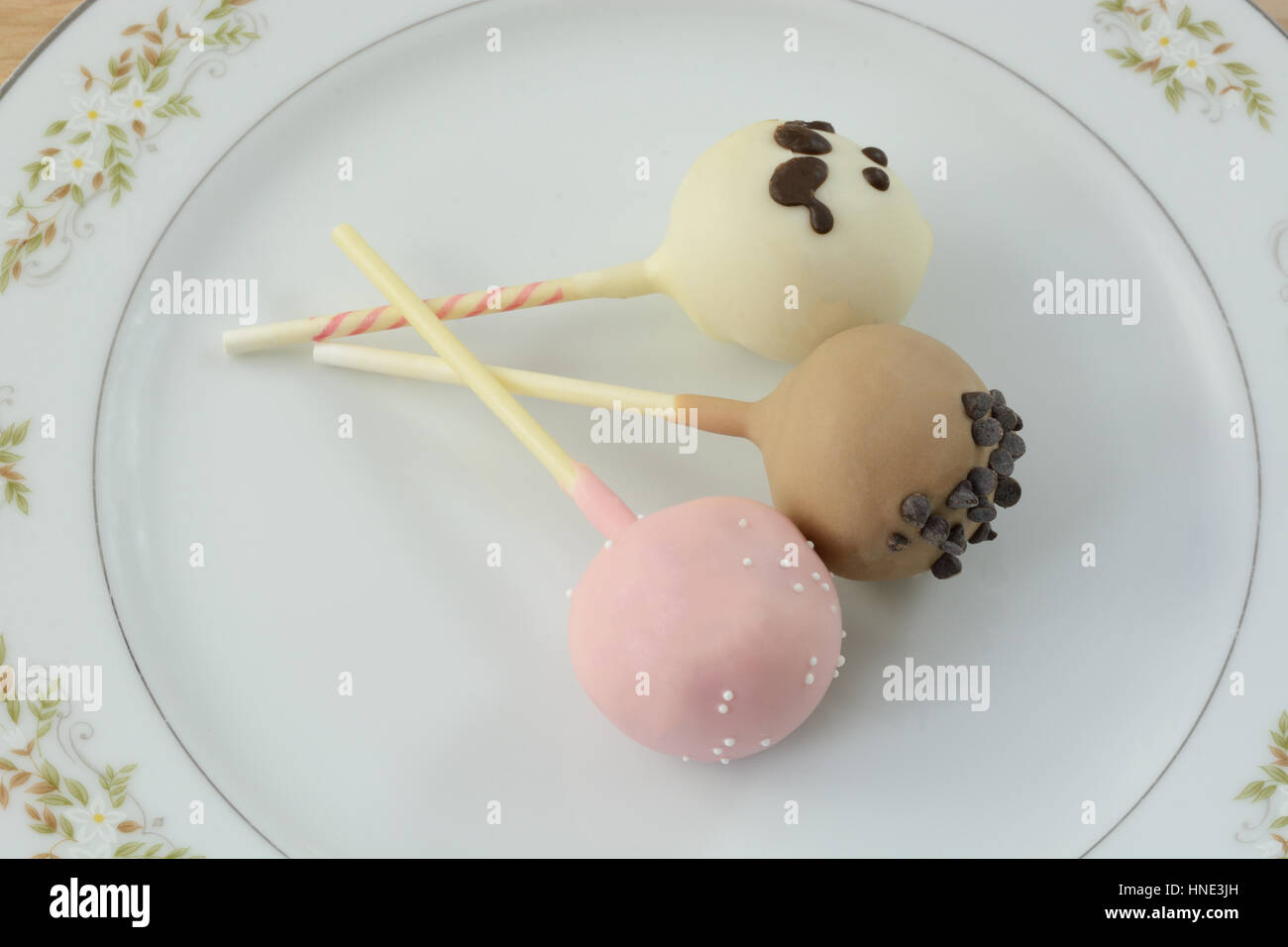 Three different cake pop popsicles on plate Stock Photo - Alamy