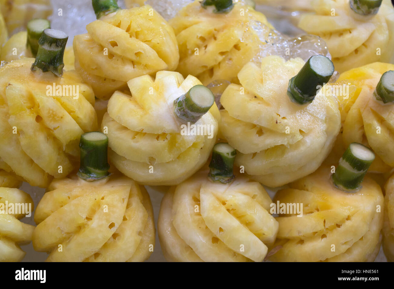 Pineapple flavored fruit is tasty sold at market Stock Photo - Alamy