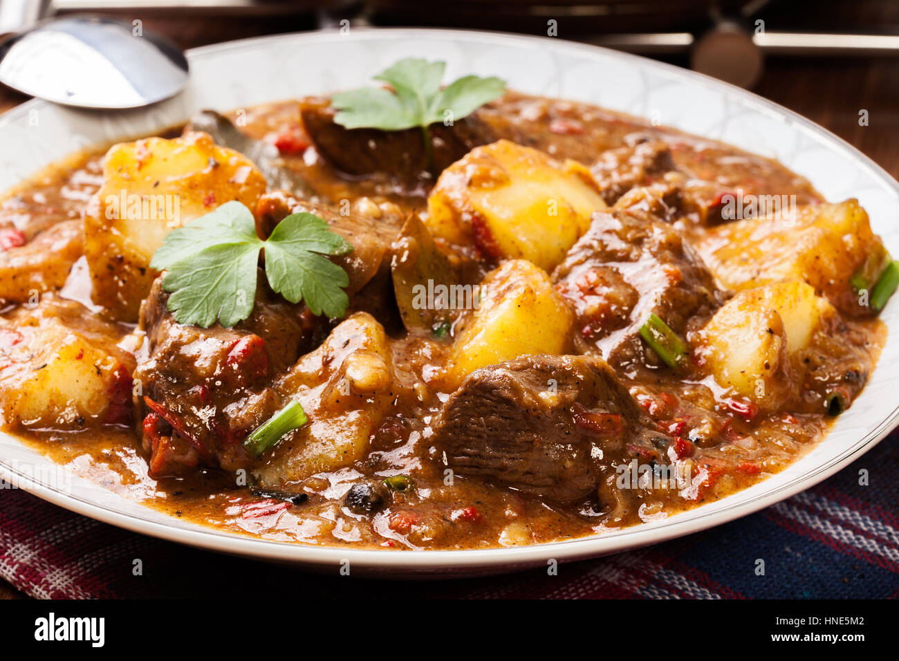 Beef stew with potatoes in a plate Stock Photo - Alamy