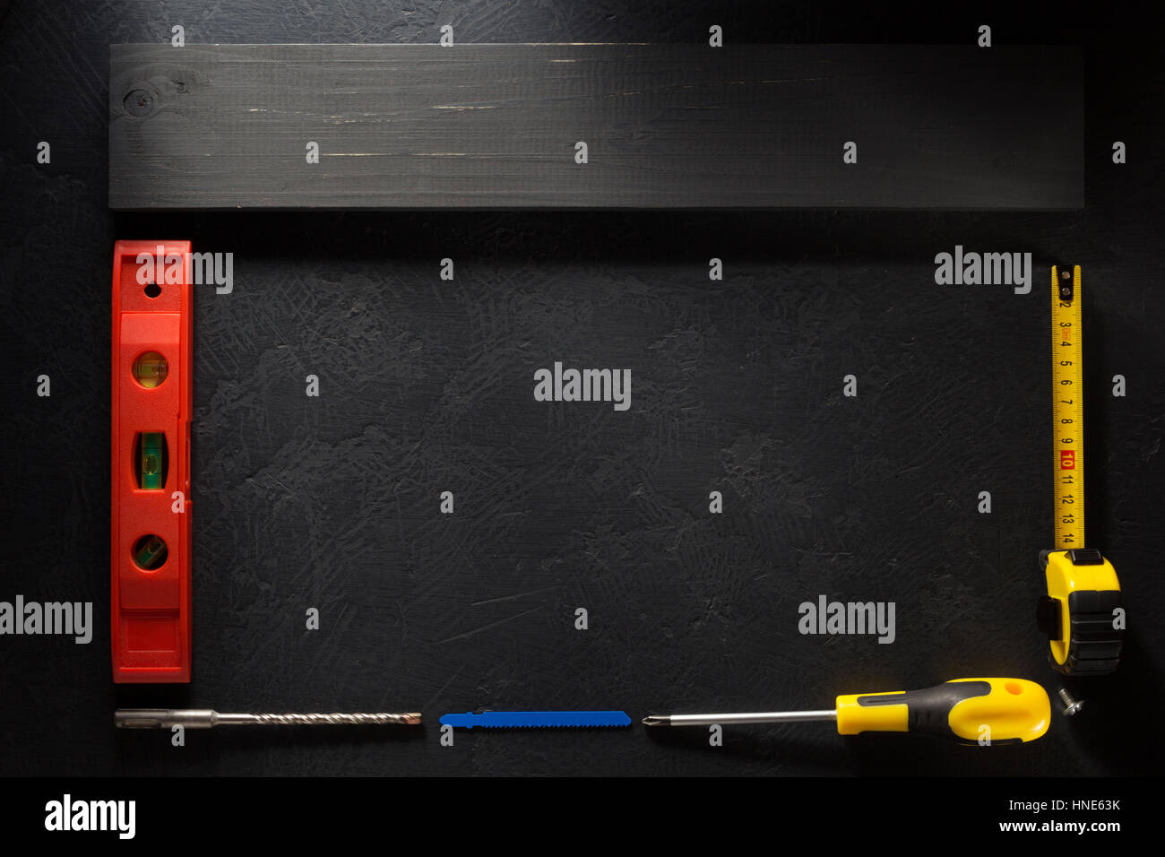 set of tools and instruments on black background Stock Photo - Alamy