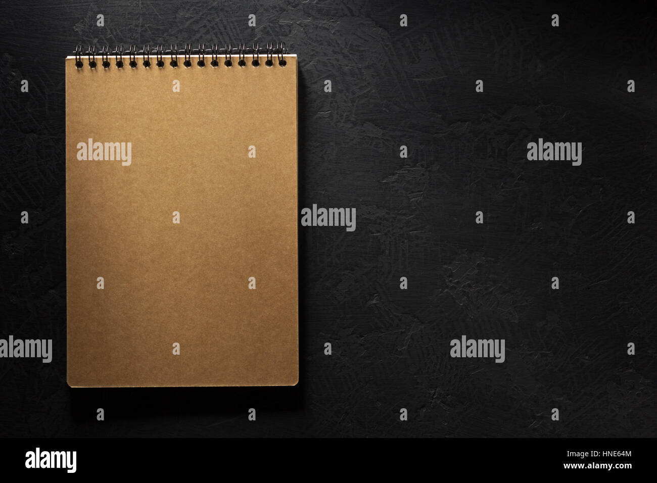 notebook on black background texture Stock Photo - Alamy