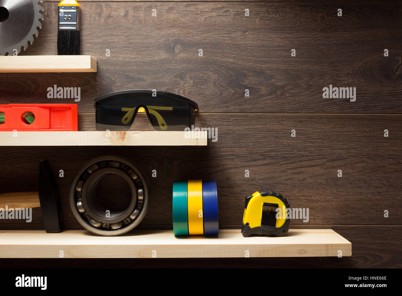 construction tools at wooden shelf background Stock Photo - Alamy