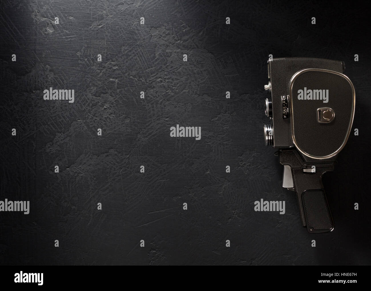 movie camera at black background texture Stock Photo - Alamy