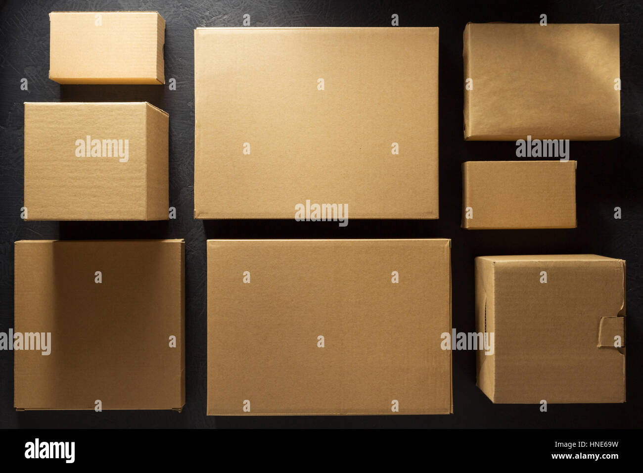 cardboard box on black background Stock Photo - Alamy
