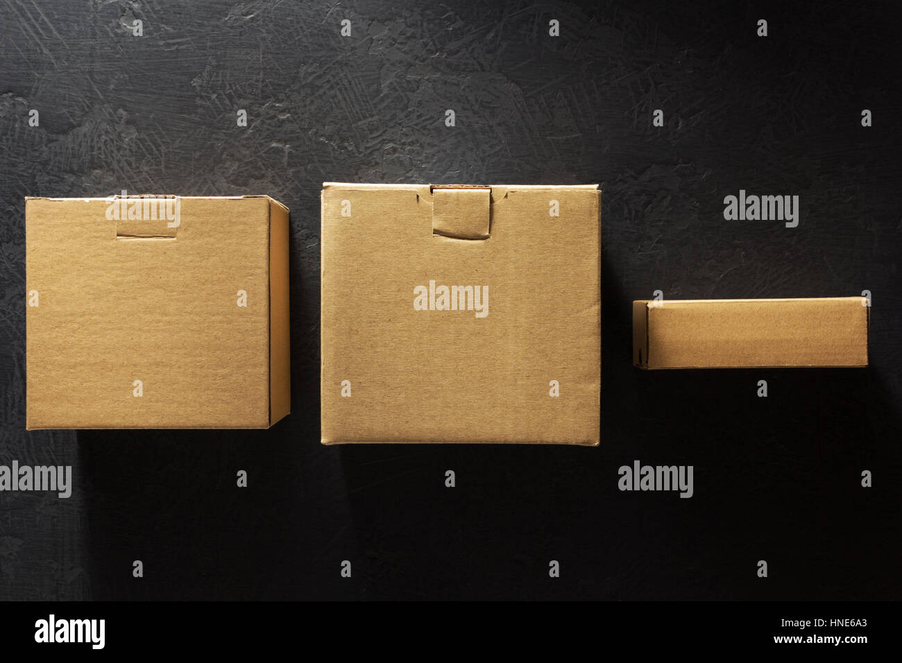 cardboard box on black background Stock Photo - Alamy