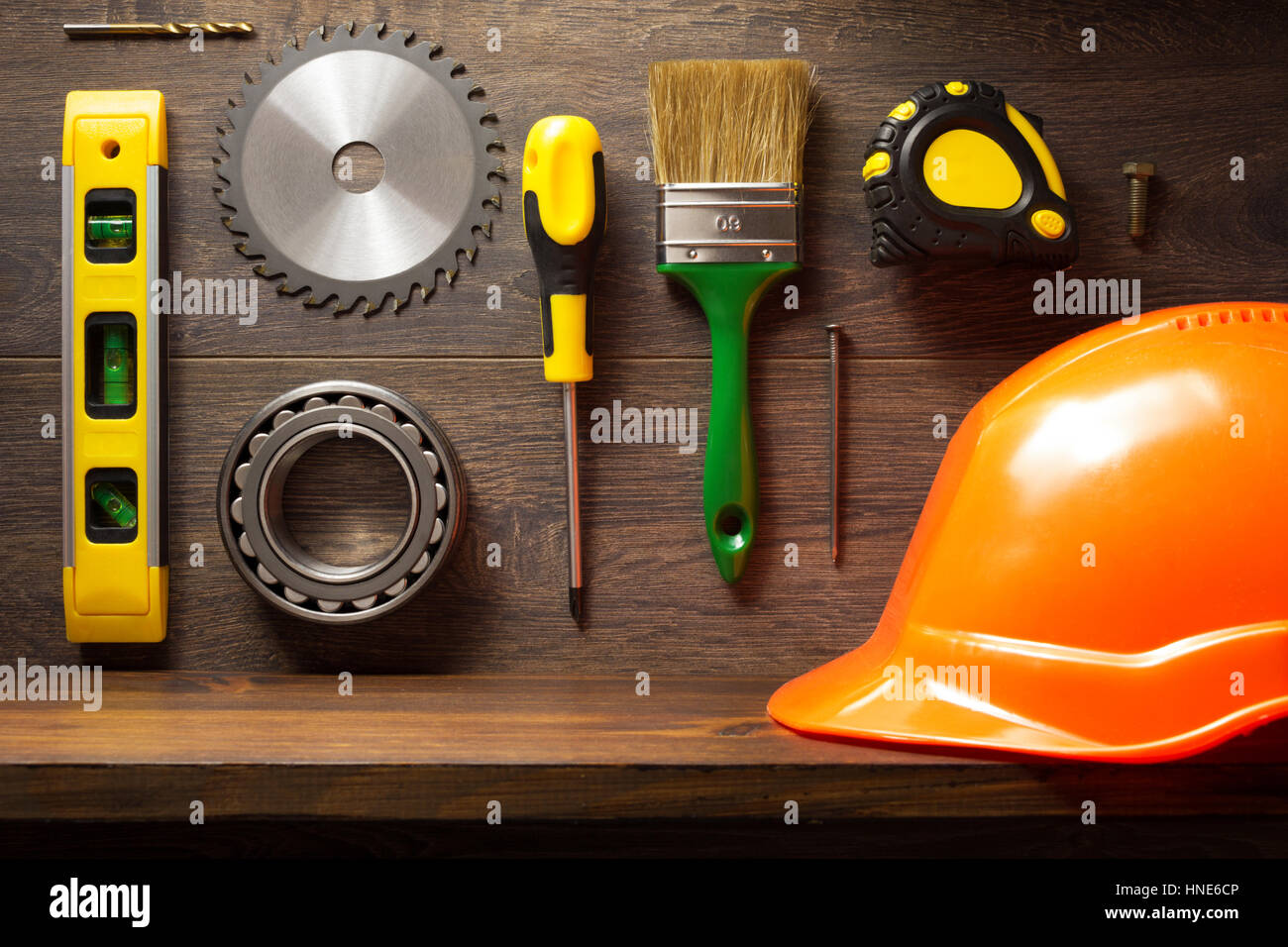 tools and wooden shelf at brown background Stock Photo - Alamy