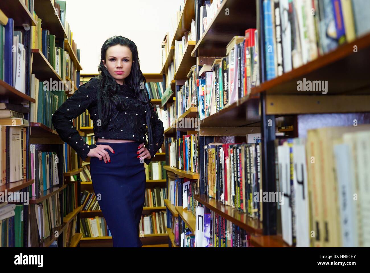 Model woman posing for camera at library Stock Photo - Alamy