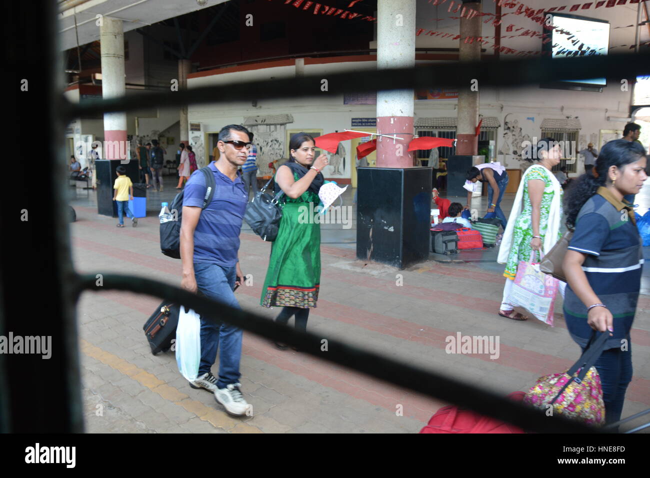 Goa, India - October 20, 2015 - People in railway station seen through ...