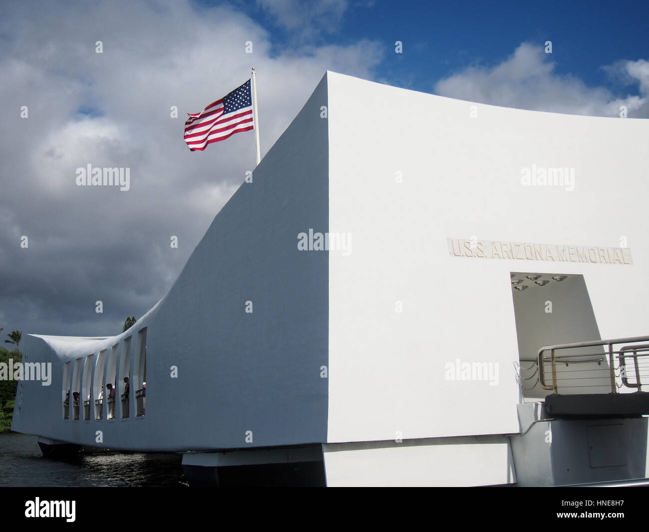 An American flag flys over the Arizona Memorial where the USS Arizona ...