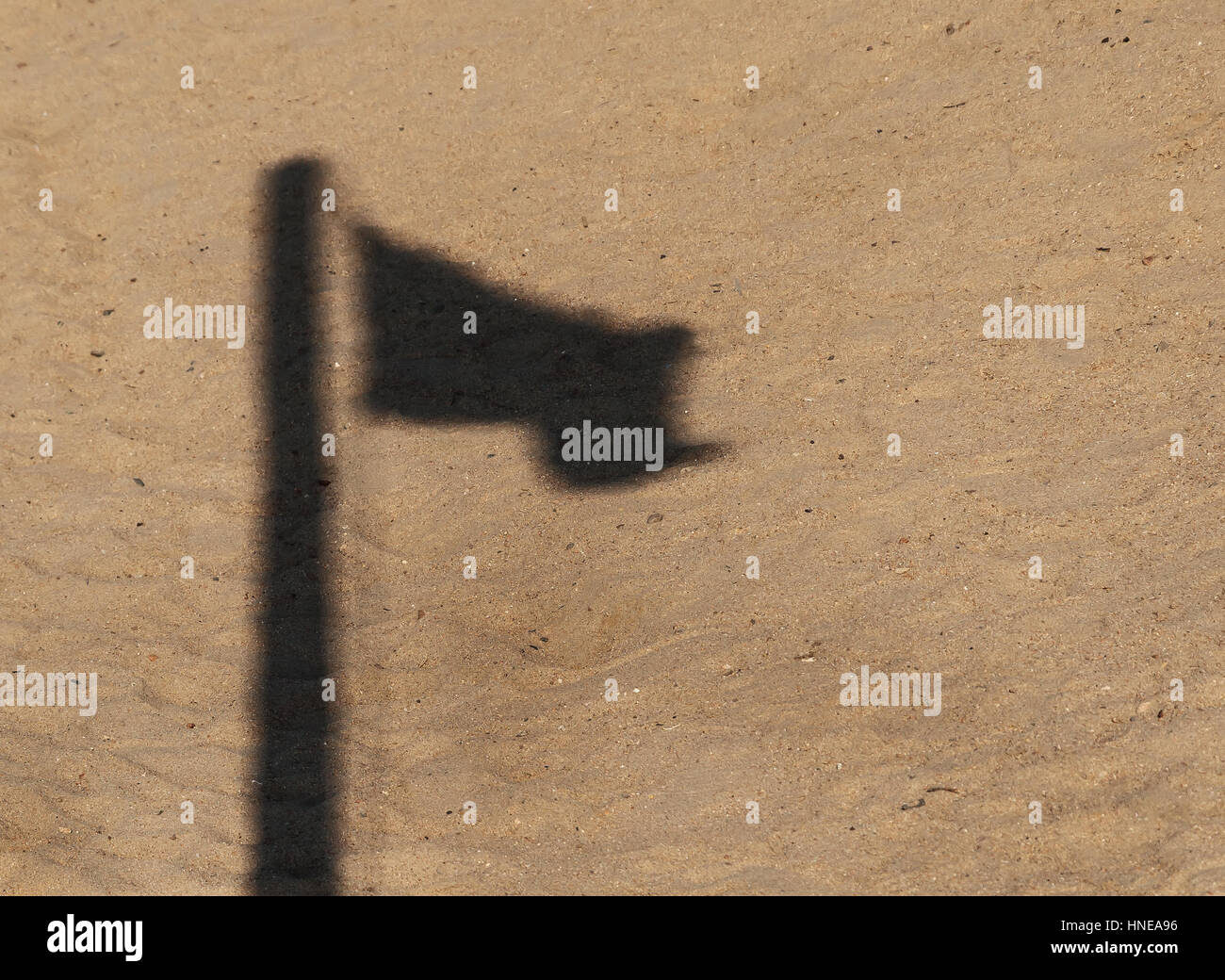 the shadow of the emerging flag in the sand Stock Photo - Alamy