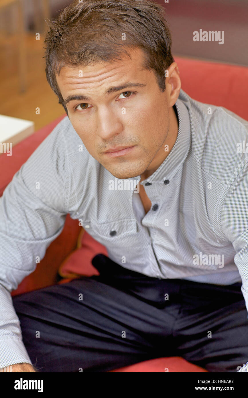 Portrait of young man contemplating Stock Photo - Alamy
