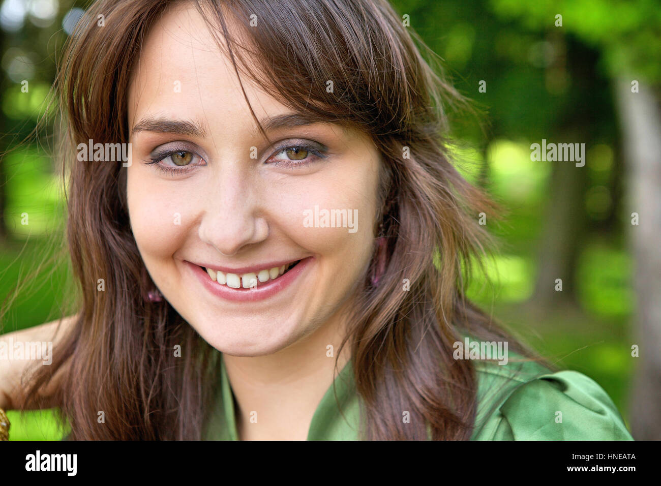 Portrait of cute young woman smiling Stock Photo - Alamy