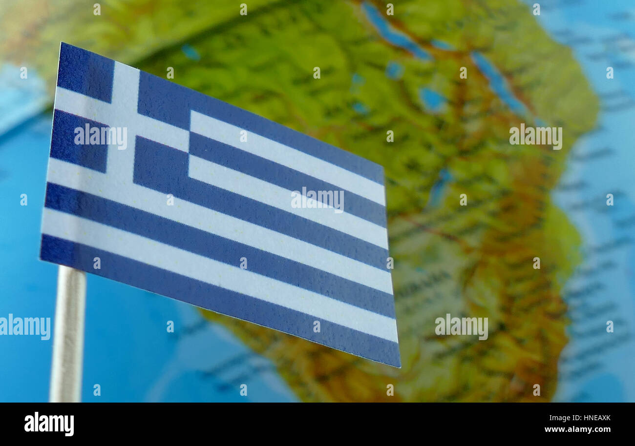 Greek flag with a globe map as a background macro Stock Photo - Alamy