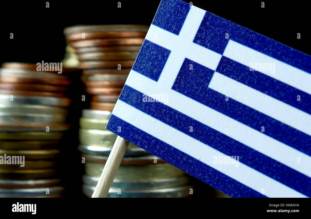 Greek flag waving with stack of money coins macro Stock Photo - Alamy