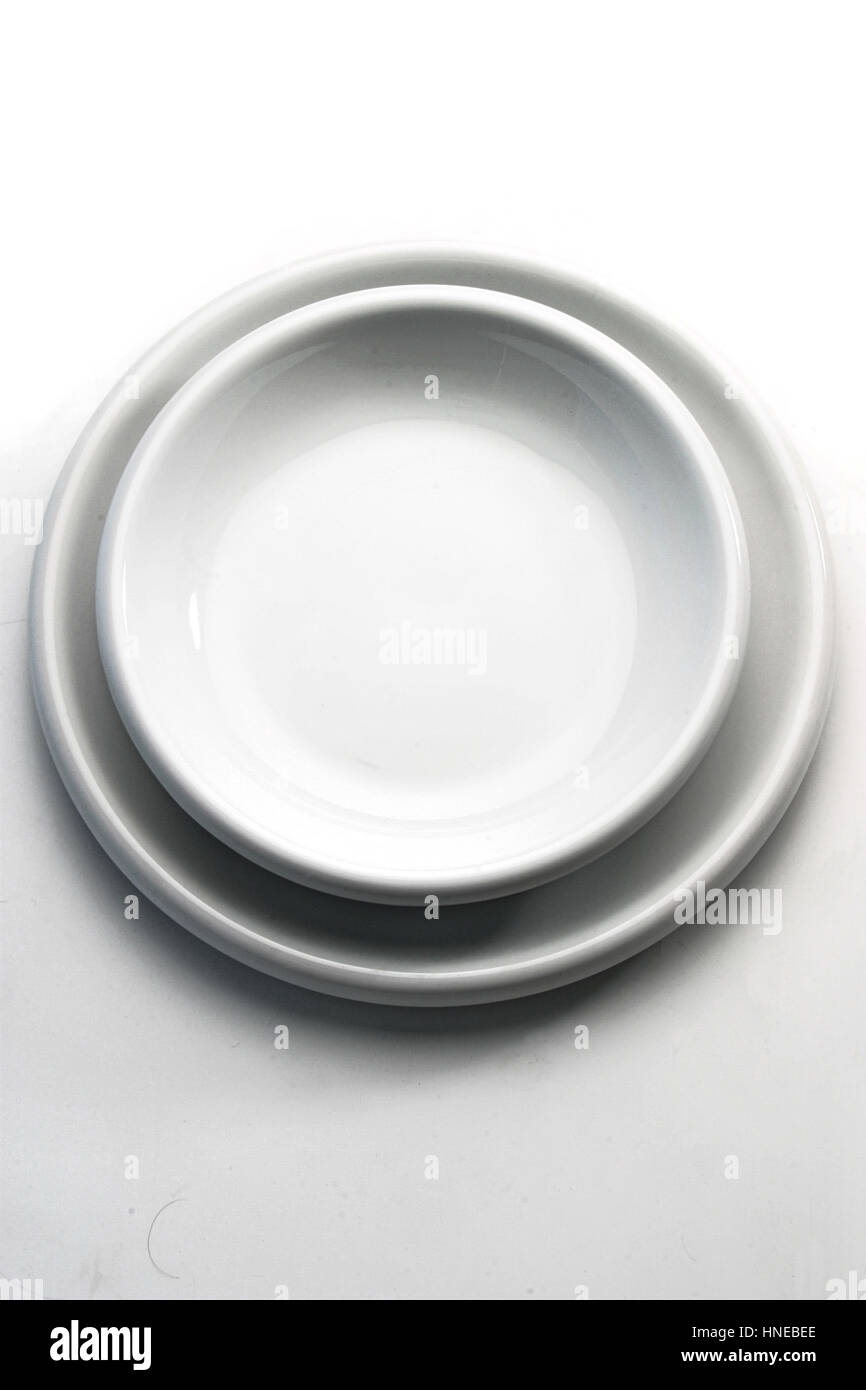 Close-up of white empty plates Stock Photo - Alamy