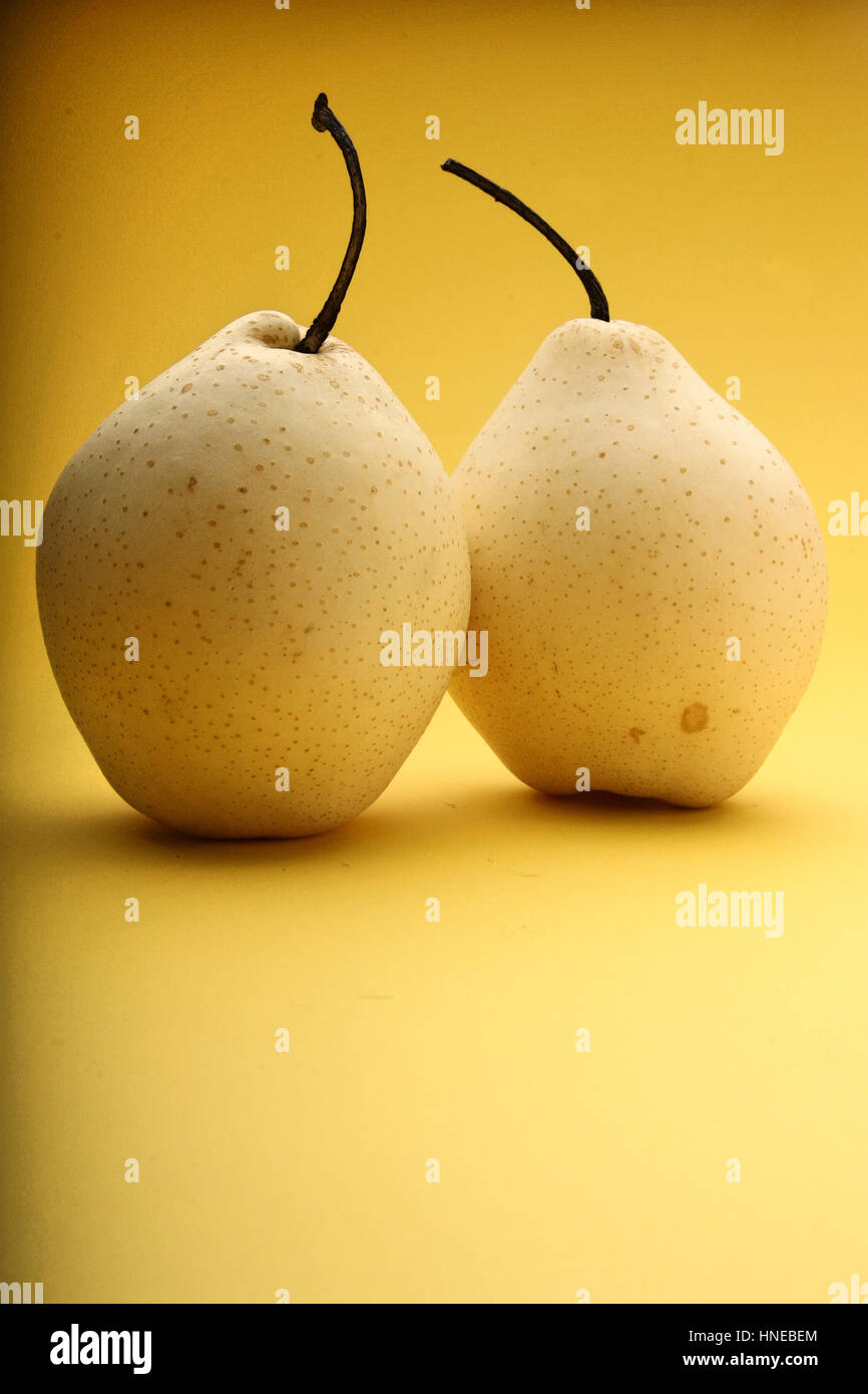 Two white pears - studio shot Stock Photo - Alamy