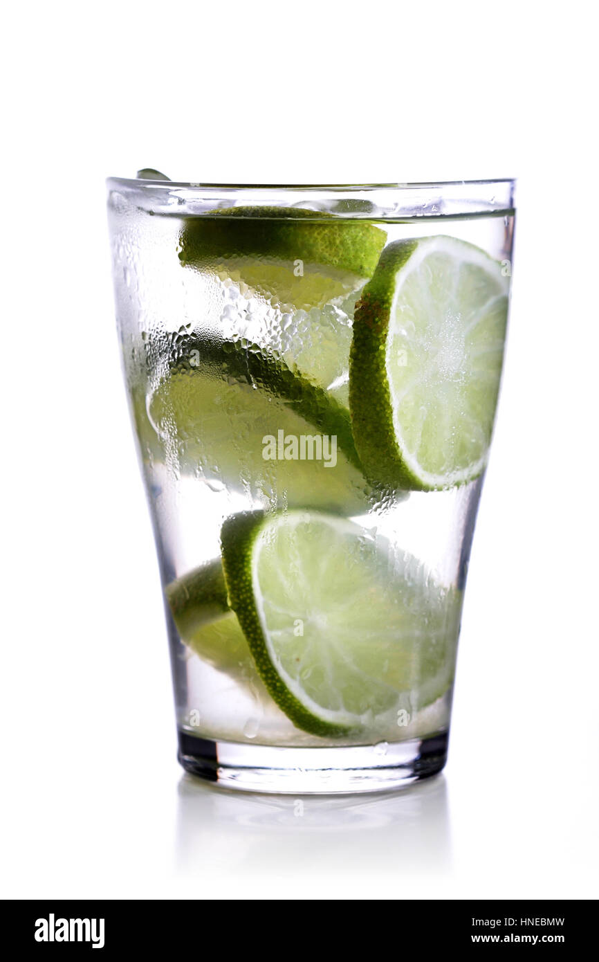 Cocktail glass ice lime slices Cut Out Stock Images & Pictures - Alamy
