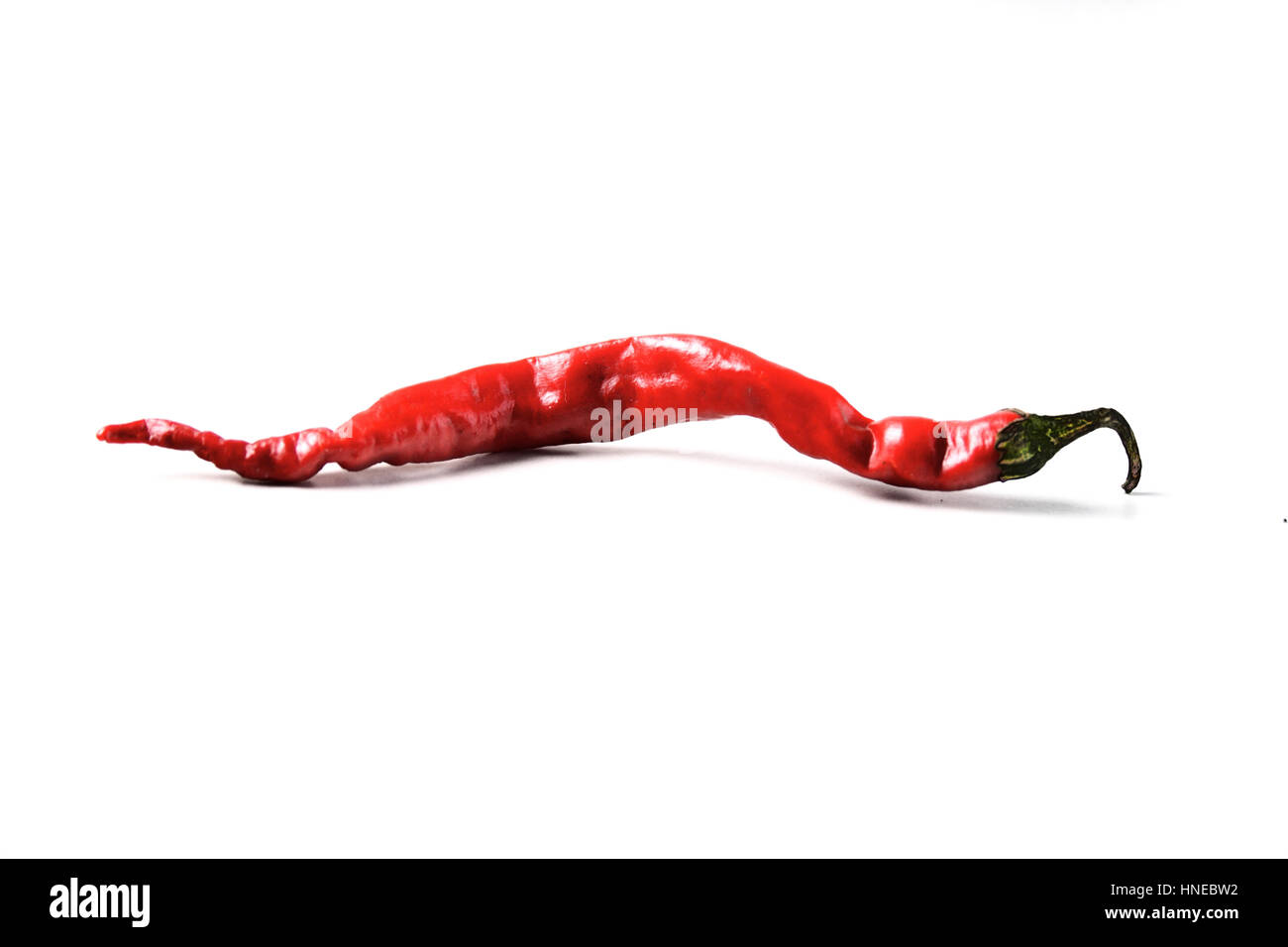 Chilli peppers on white background Stock Photo - Alamy