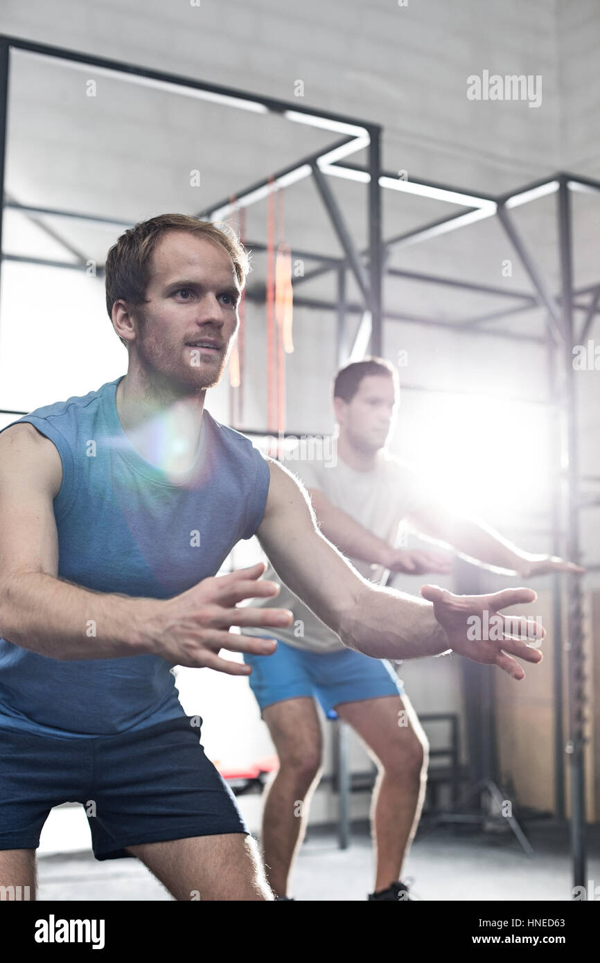 Determined men exercising at crossfit gym Stock Photo - Alamy