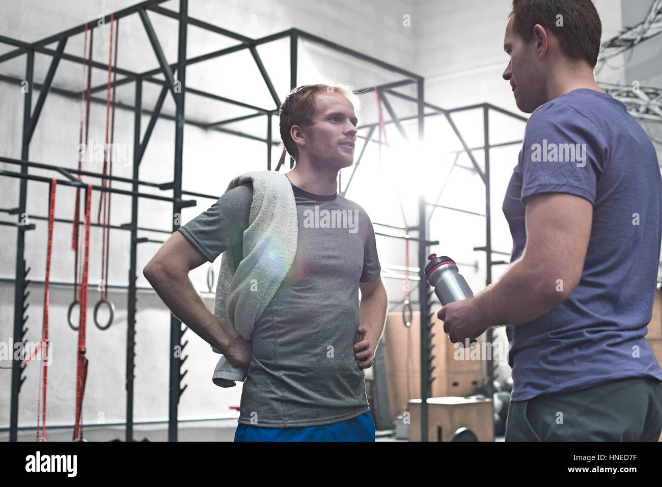 Male friends talking in crossfit gym Stock Photo - Alamy