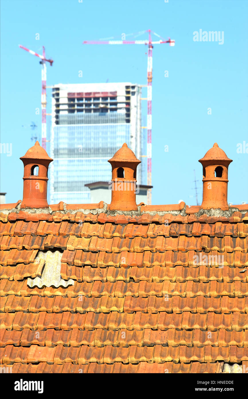Three old chimney pot with modern construction in the background Stock ...