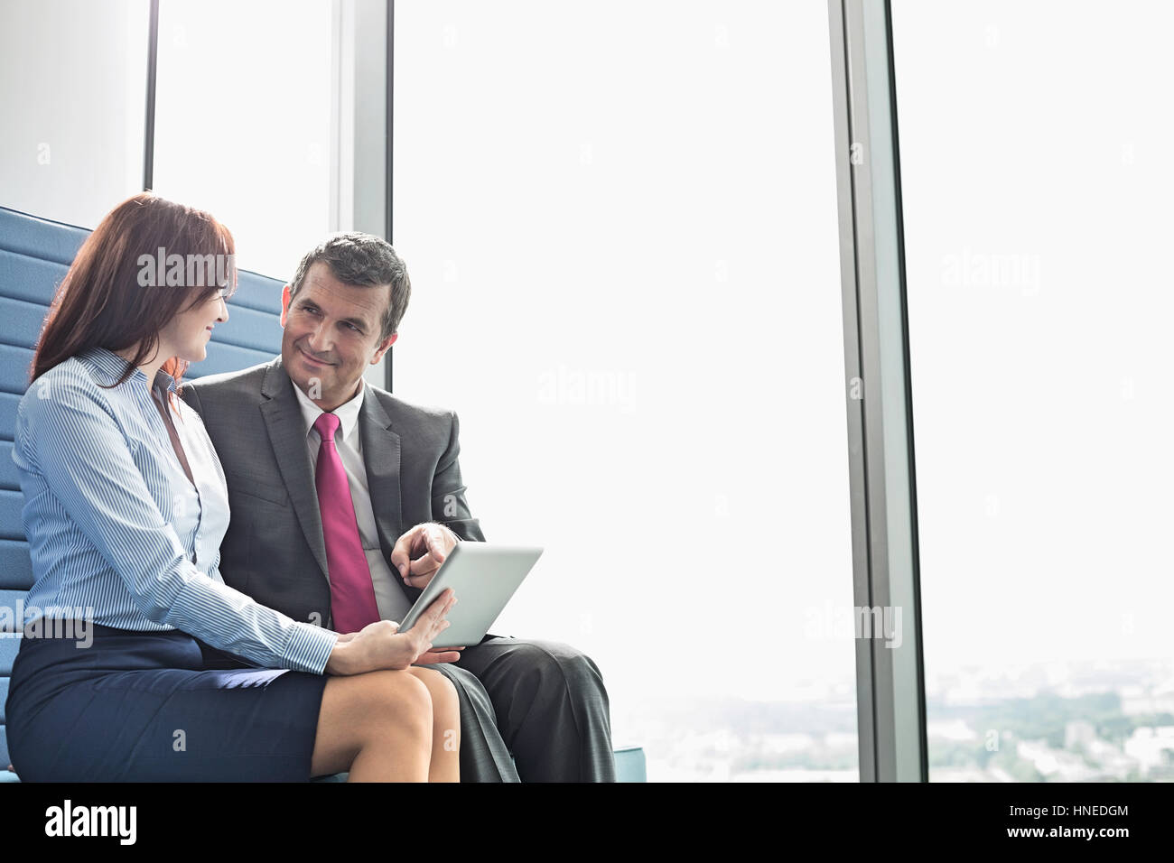Business people using tablet PC in office Stock Photo - Alamy