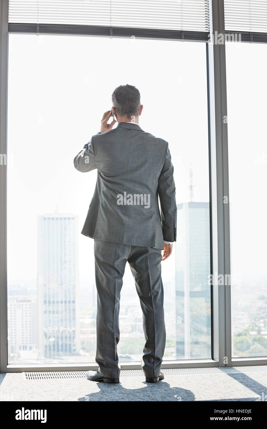 Mature man standing rear view hi-res stock photography and images - Alamy