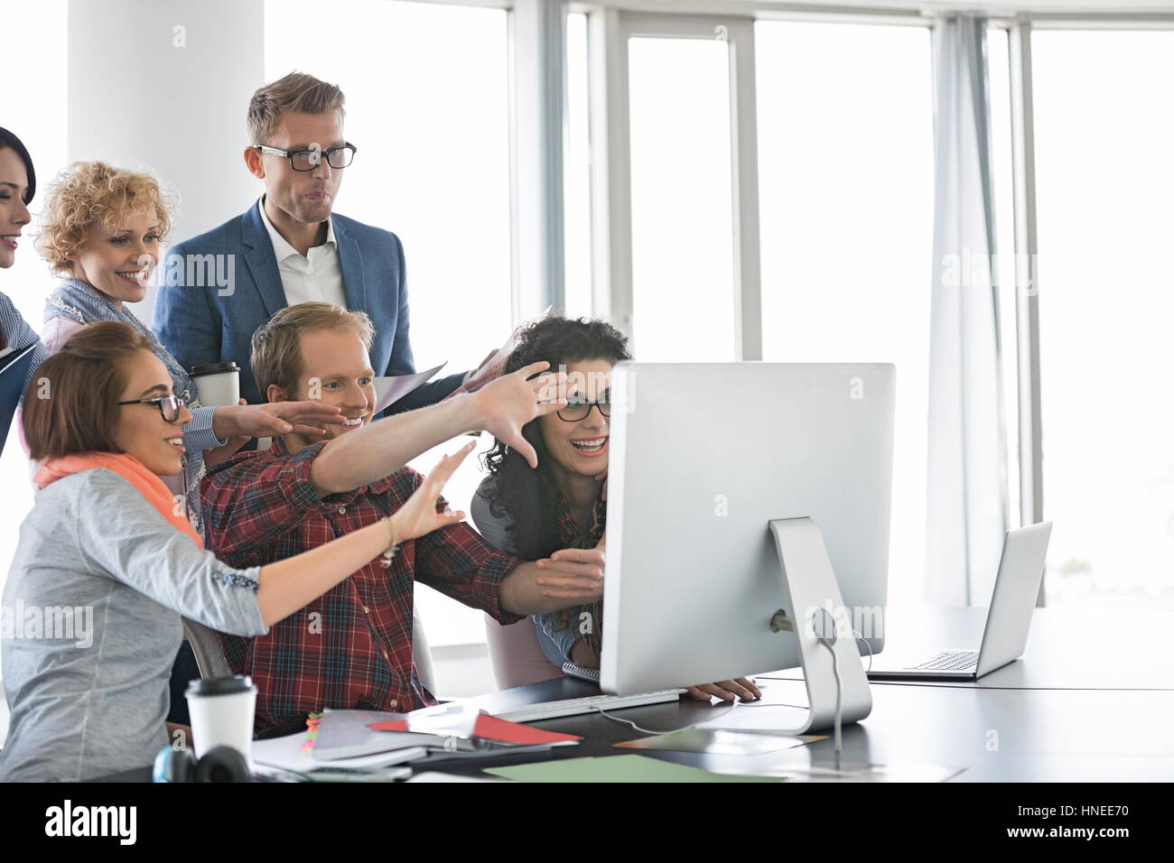 Business people using computer in office Stock Photo - Alamy