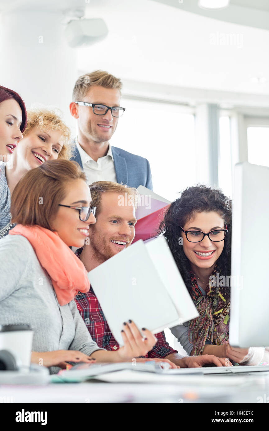 Business people using computer in creative office Stock Photo - Alamy