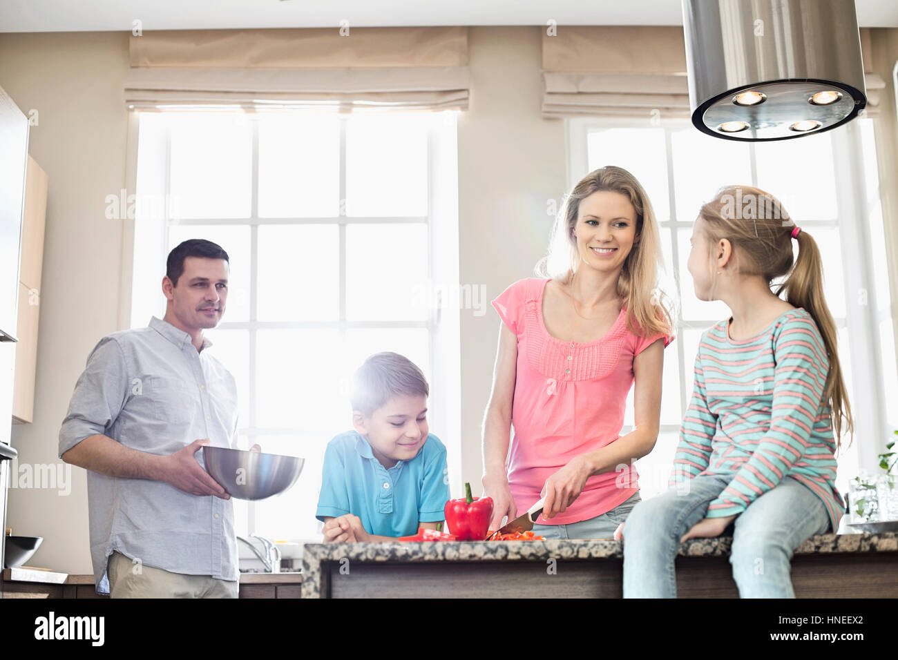 Family preparing food in kitchen 10 12 years hi-res stock photography ...