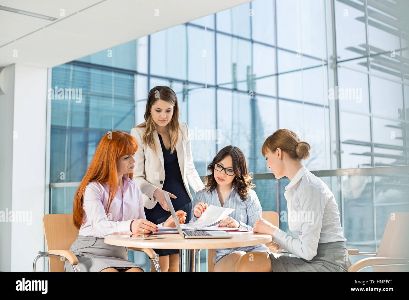Working at table hi-res stock photography and images - Alamy