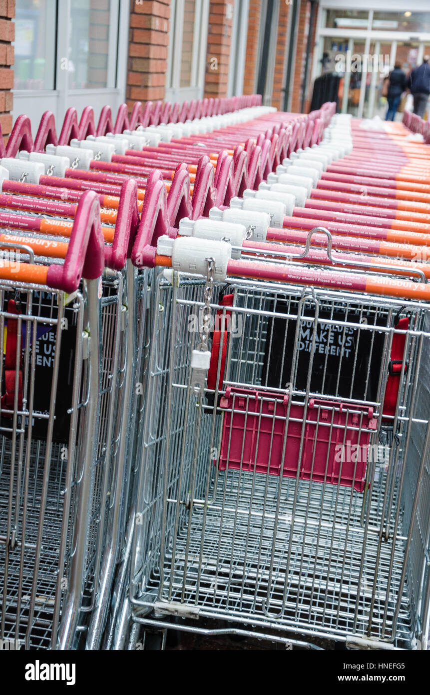 Rows of trolleys outside a Sainsbury's supermarket Stock Photo - Alamy