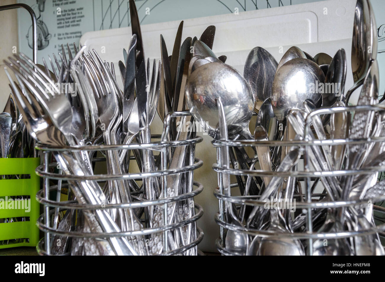 Stainless steel cutlery on a kitchen worktop Stock Photo - Alamy