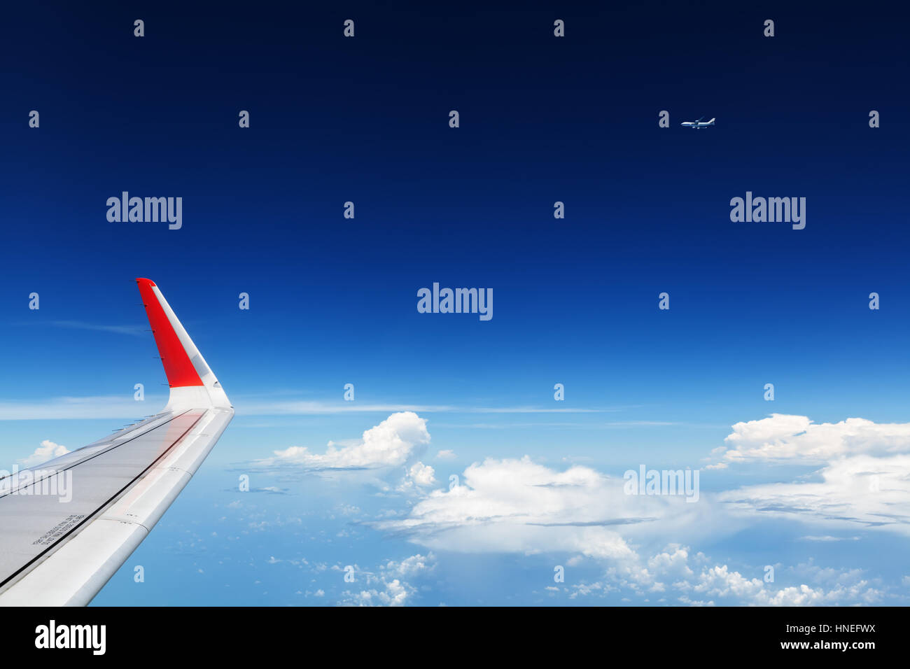Oncoming flight traffic in mid air. Plane flying above beautiful earth ...