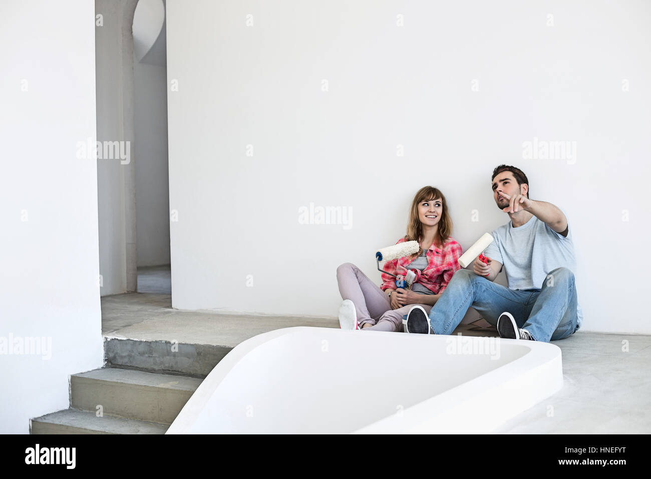 Couple getting ready to paint Stock Photo - Alamy