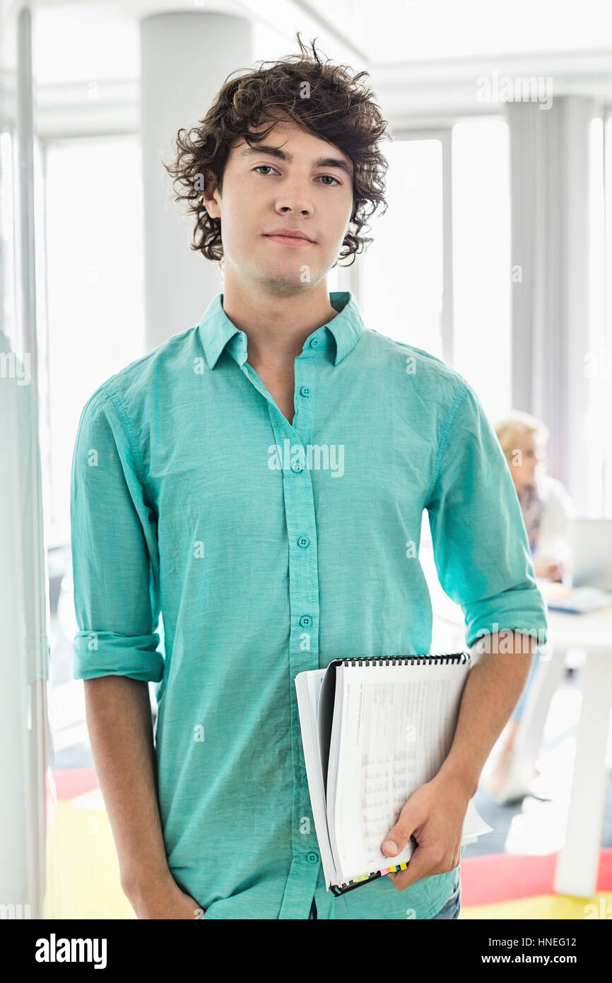Business man holding files hi-res stock photography and images - Alamy