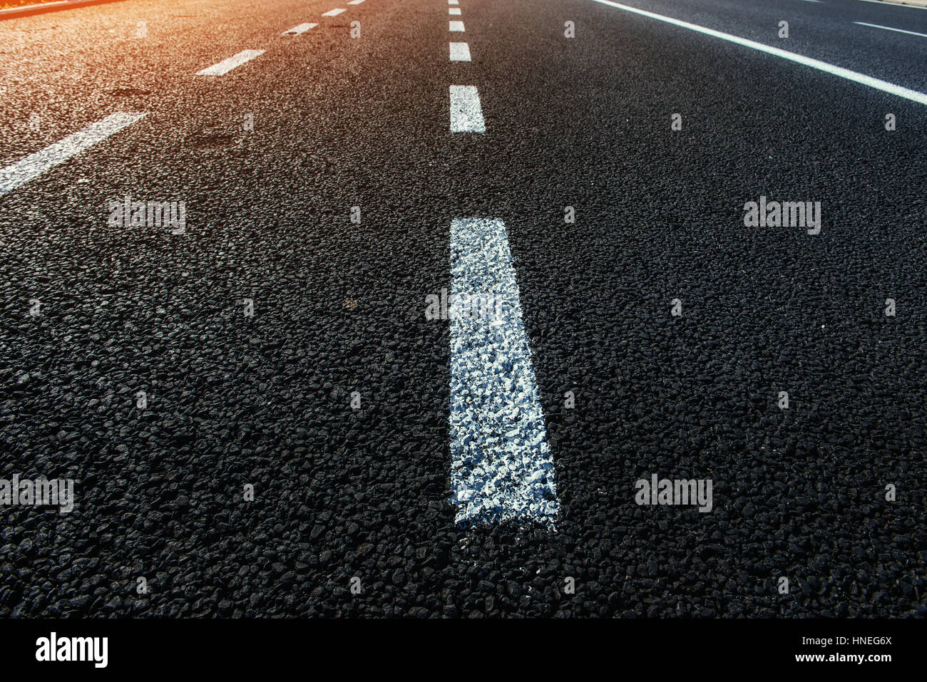 New asphalt texture with white dashed line Stock Photo - Alamy