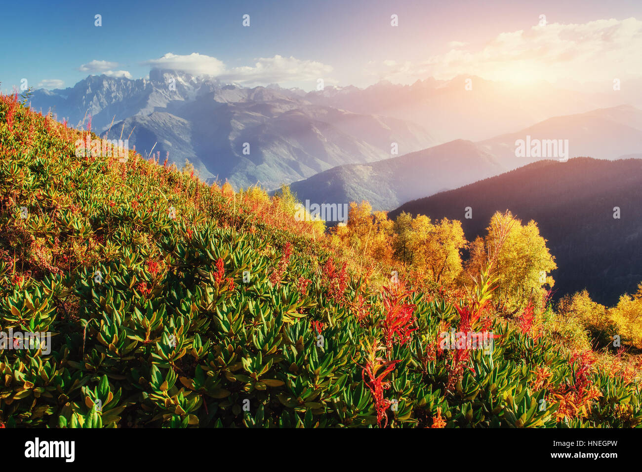 Sunset over snow-capped mountain peaks Stock Photo - Alamy